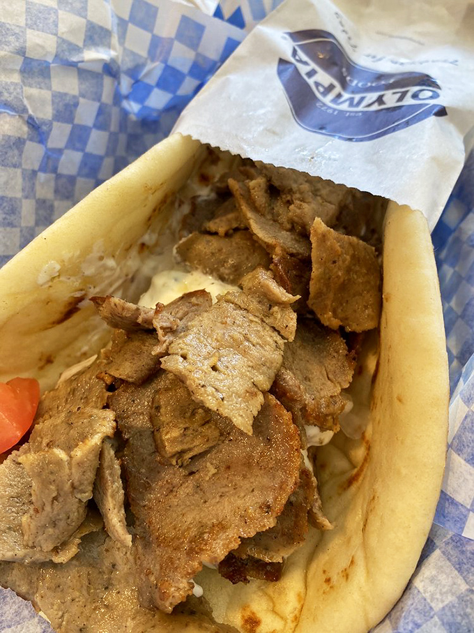 Up close and personal with the star of the show: tender slices of seasoned meat nestled in a pillowy pita, ready for its close-up.
