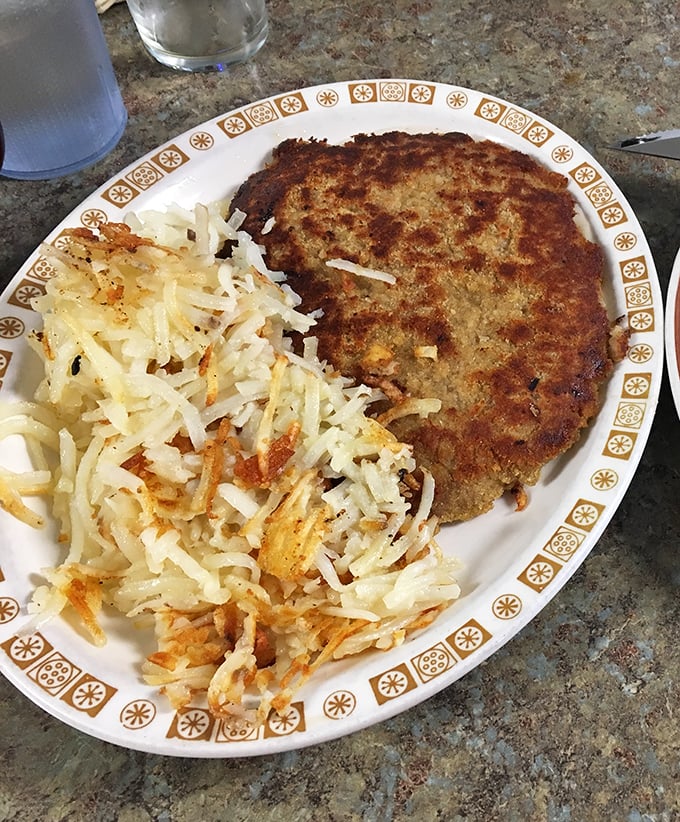 The chicken fried steak's faithful companion? Those glorious hash browns—shredded, seasoned, and transformed into golden perfection on a well-seasoned griddle.