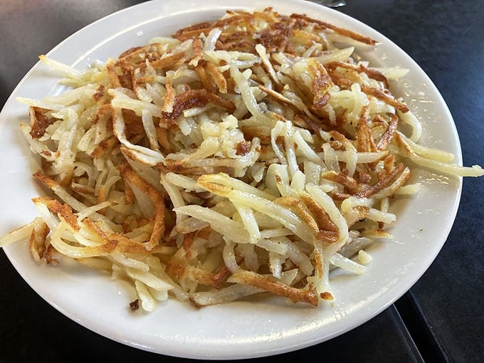 Hash browns that achieve the impossible trifecta: shatteringly crisp exterior, tender interior, and enough surface area to maximize the all-important crunch factor.
