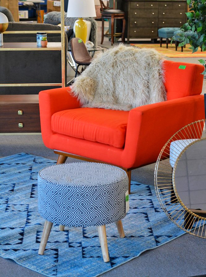 Mid-century modern meets bargain hunter's dream. This vibrant orange chair isn't just furniture—it's a statement piece with a whisper-quiet price tag.
