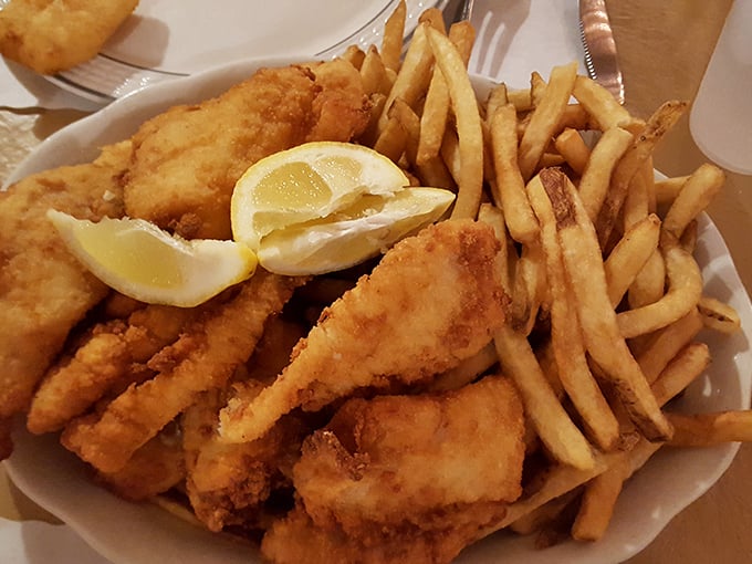 The holy trinity of Wisconsin dining: perfectly fried cod, hand-cut fries, and that essential lemon wedge for brightening it all.