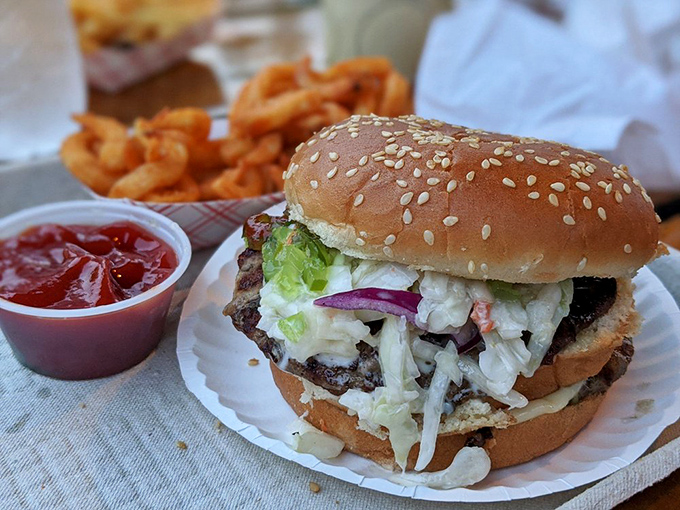 A double-decker masterpiece with all the fixings. That cascade of fresh toppings isn't just garnish&mdash;it's an essential part of the Jumpin' Jack's experience.