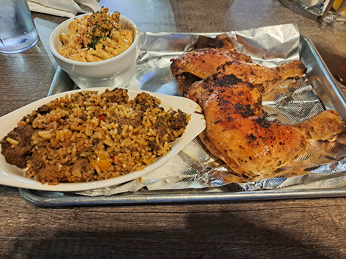 A plate that tells a story: perfectly blackened chicken alongside dirty rice that's been mingling with spices long enough to become best friends.