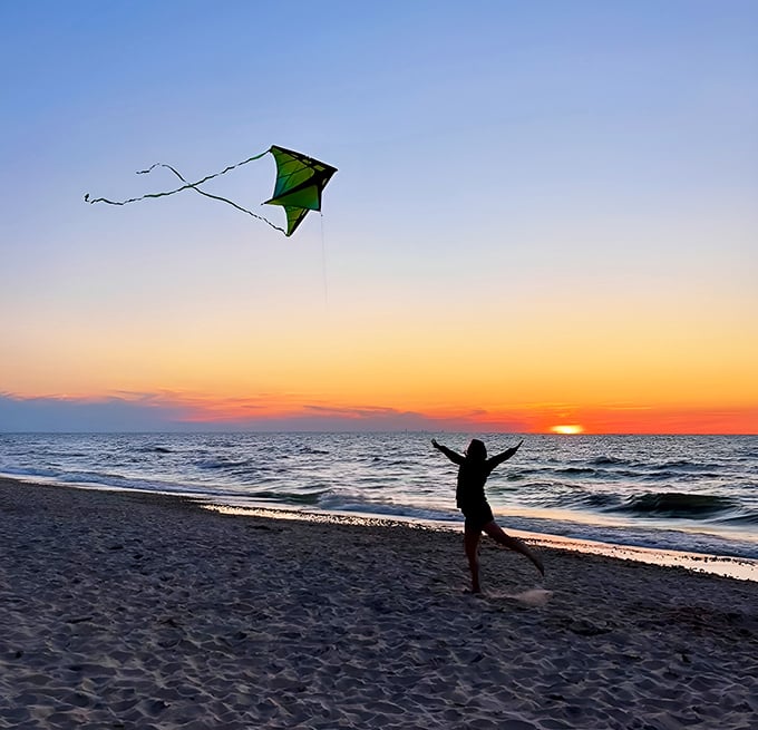 Freedom takes flight at the edge of the Midwest. Nothing says "I'm on vacation" quite like running wild with a kite against a sunset that belongs in a travel magazine.
