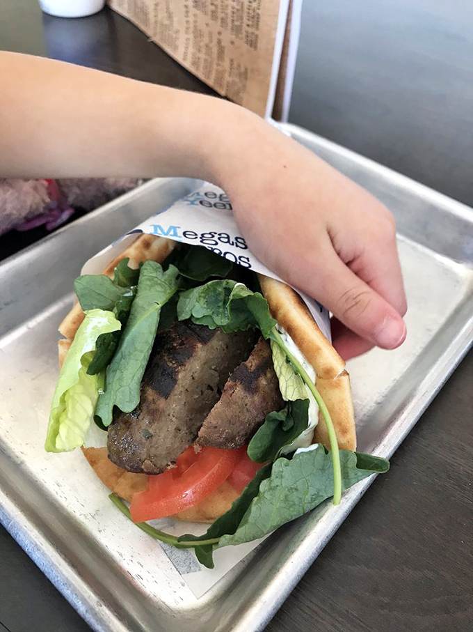Behold the lamb gyro&mdash;where tender, herb-infused meat, fresh greens, and juicy tomatoes create a harmony that would make Zeus himself weep with joy.