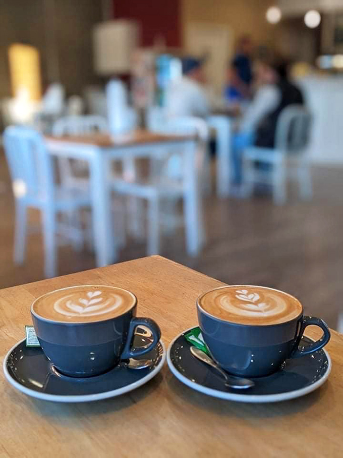 Two cups of coffee artistry sitting side by side, like the Lennon and McCartney of lattes, harmonizing in caffeinated perfection.