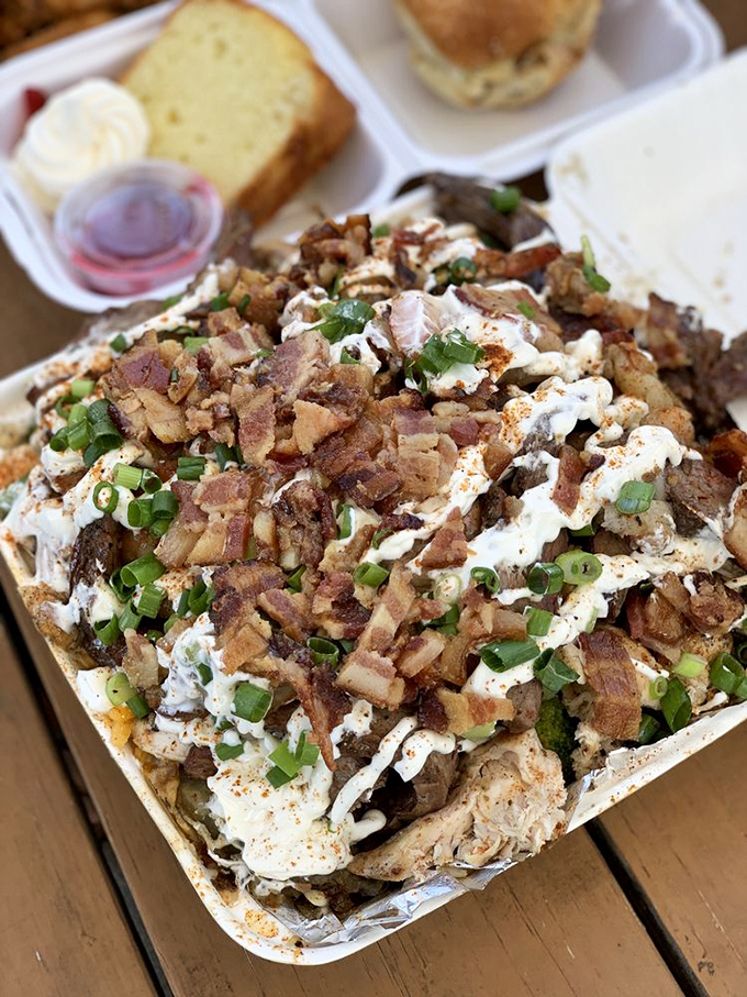This isn't just a loaded potato&mdash;it's an architectural marvel of bacon, cheese, green onions, and sour cream that demands to be photographed before devoured.