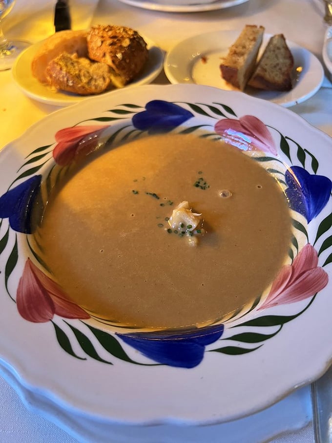 This lobster bisque doesn't just whisper of the sea&mdash;it tells entire maritime stories. The delicate garnish in the center is like the period at the end of a perfect sentence.