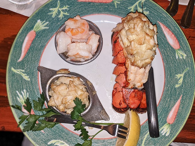 The holy trinity of seafood perfection: a succulent lobster tail, plump shrimp, and delicate crab meat&mdash;a plate that makes you want to send thank-you notes to the ocean.