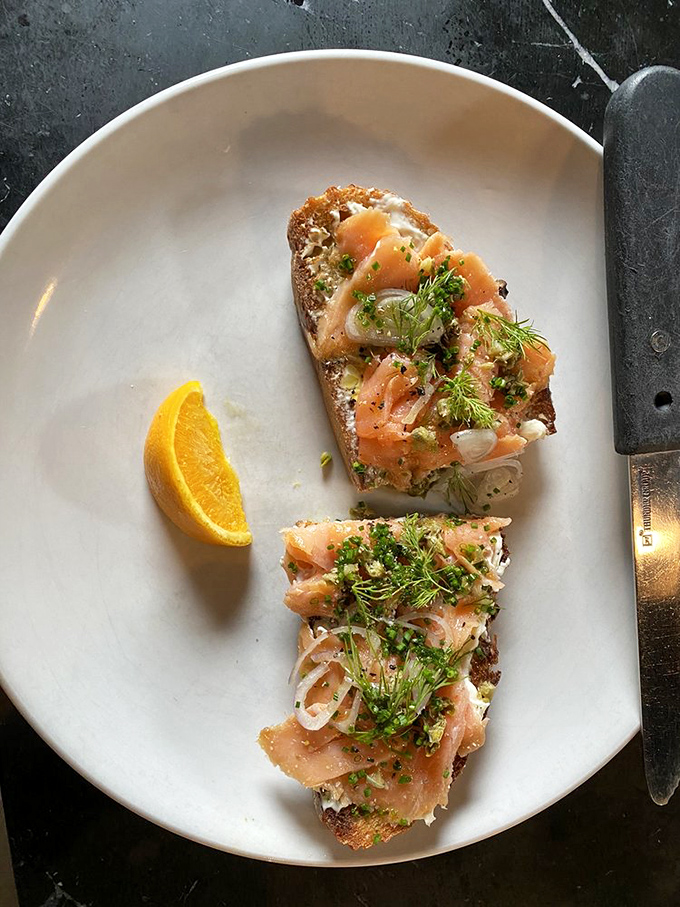 The LOX toast arrives like edible art&mdash;salmon draped elegantly over cream cheese with fresh dill playing the role of confetti at this breakfast celebration. 