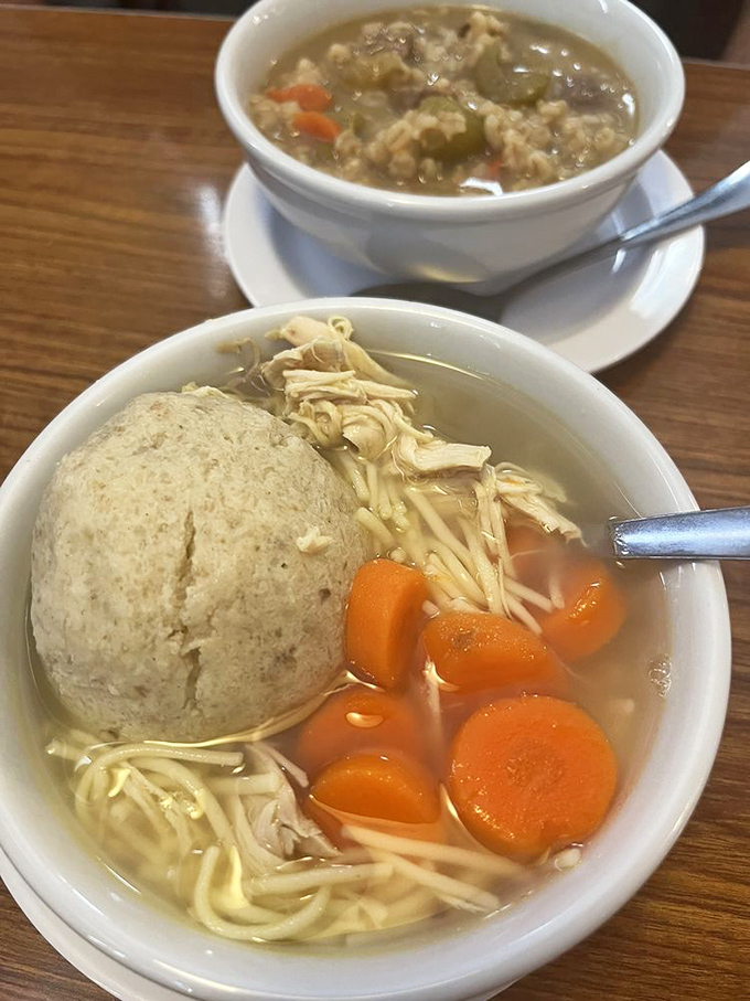 The soup that launched a thousand "aahs." That hearty barley soup in back is playing supporting actor to the real star&mdash;matzo ball soup.