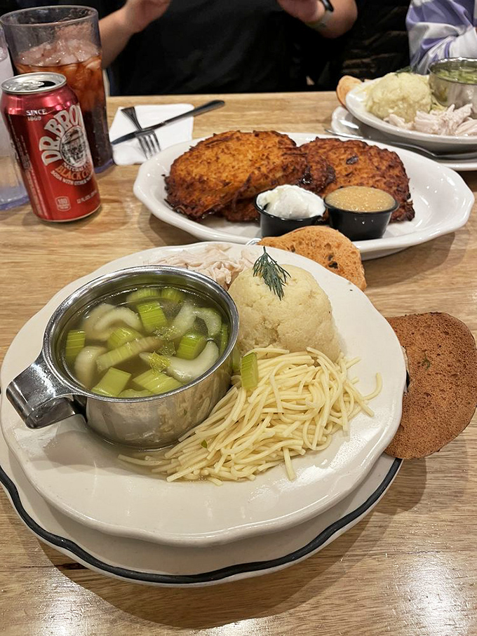 The latkes look like they're auditioning for a food magazine cover while the matzo ball sits proudly center-stage, waiting for its standing ovation.
