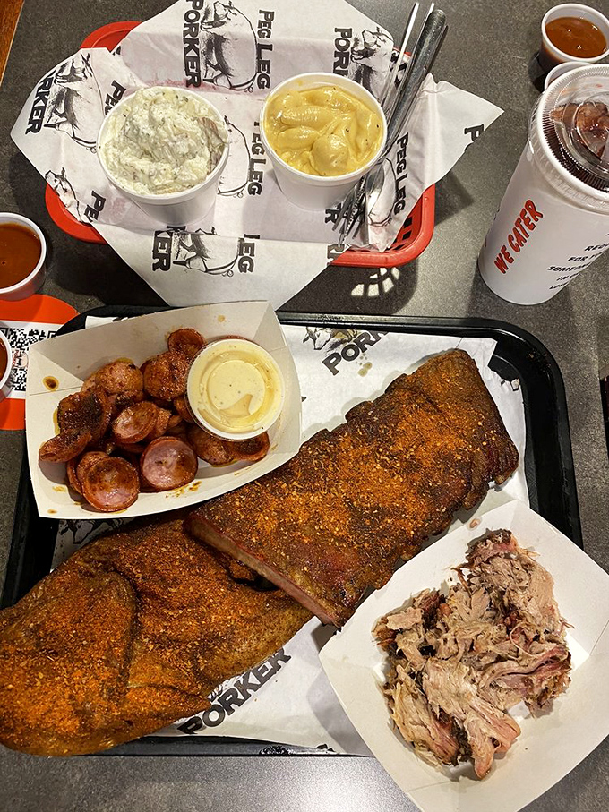 The holy trinity of barbecue: perfectly smoked meat, creamy mac and cheese, and tangy sauce. This is what happiness looks like on a plate.