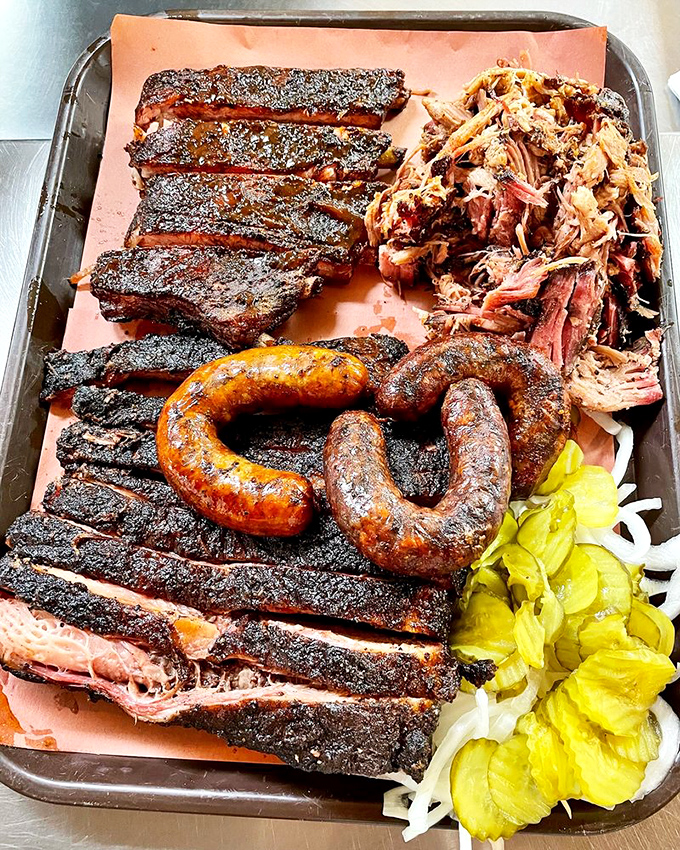 The Pitmaster sandwich doesn't just satisfy hunger—it obliterates it. Topped with jalapeños for those who believe food should bite back occasionally.