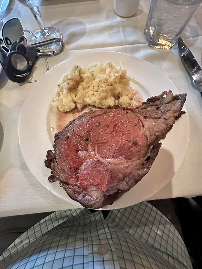 The kind of prime rib that makes conversation stop mid-sentence. That mashed potato side isn't playing second fiddle; it's in a duet.
