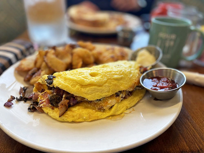 This omelet didn't just break free from its shell &ndash; it found its life's purpose wrapped around savory fillings and nestled beside crispy potatoes.