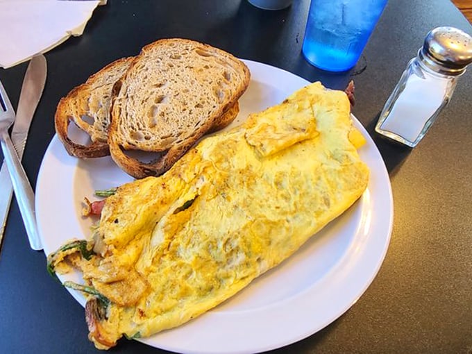 This isn't just an omelet &ndash; it's a golden envelope delivering a message of breakfast joy directly to your taste buds.