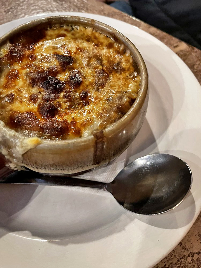 Bubbling, golden perfection in a crock. This isn't just soup; it's the reason alarm clocks were invented across Columbus.