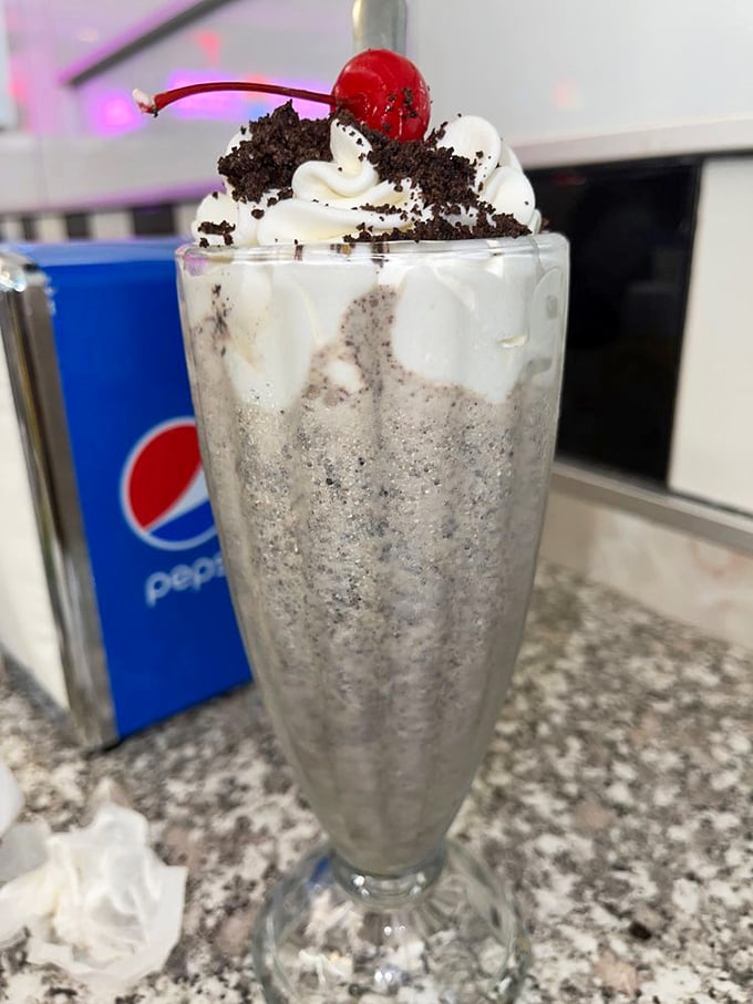 The cookies and cream shake arrives with such dramatic flair, it deserves its own Broadway musical: "Oreo: The Sweet Life."