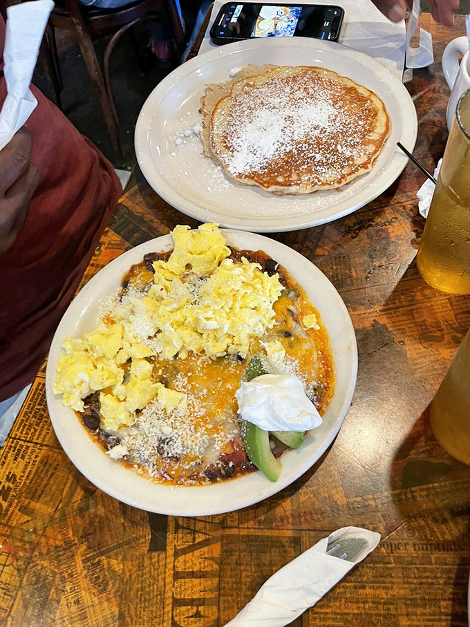 Pancakes and eggs sharing a plate like old friends at a reunion, with each bite promising the comfort only breakfast can deliver.