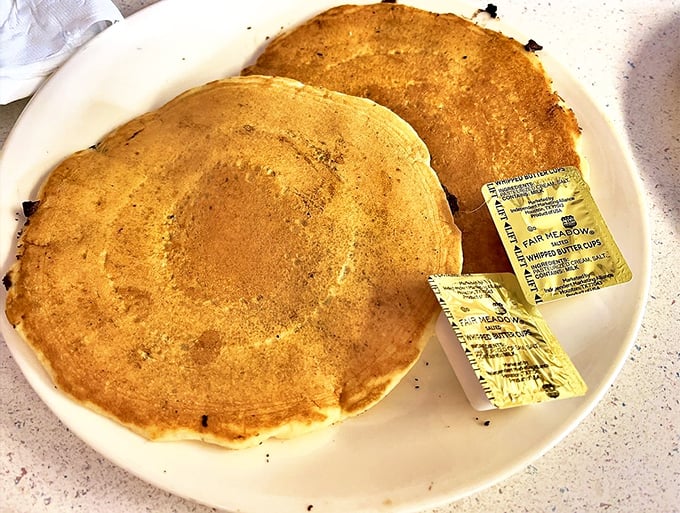 These aren't just pancakes; they're golden discs of joy that make you question why anyone would ever skip breakfast.
