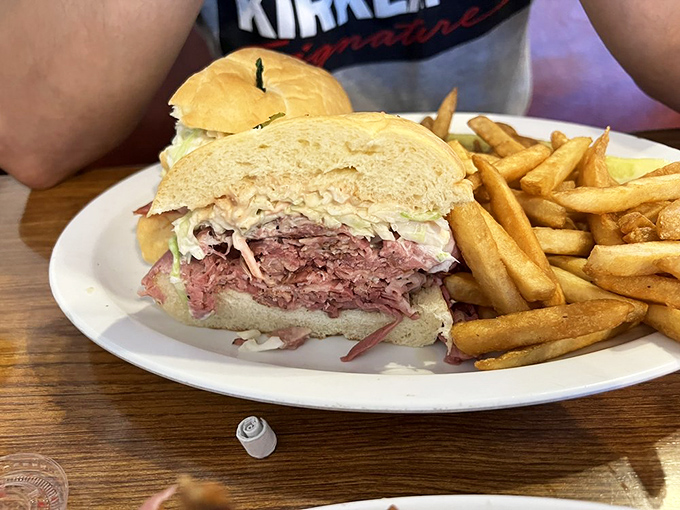 This isn't just a sandwich; it's a pastrami monument that would make New Yorkers weep with jealousy. Note the perfect meat-to-bread ratio – that's sandwich science.