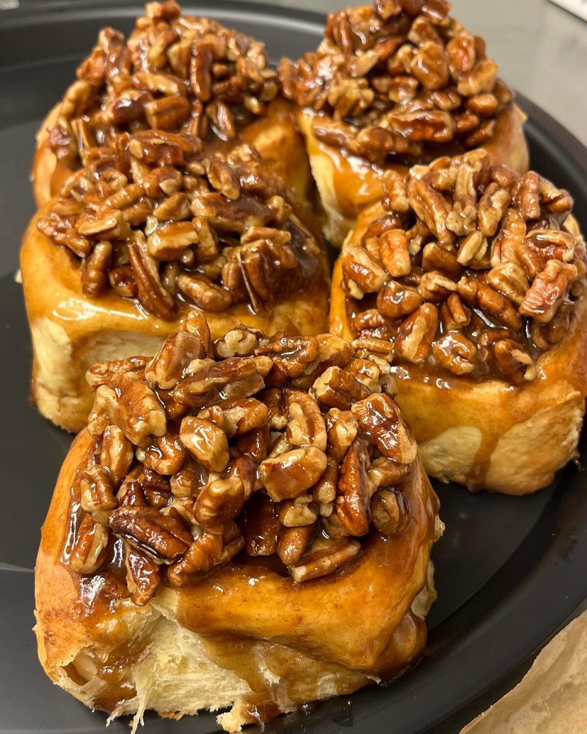 The pecan-topped cinnamon rolls look like they're auditioning for a breakfast starring role in your personal food memories.