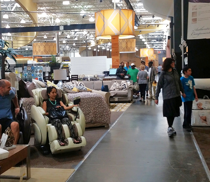 Shoppers navigate the furniture wonderland, some testing massage chairs that make dental appointments seem like torture by comparison.