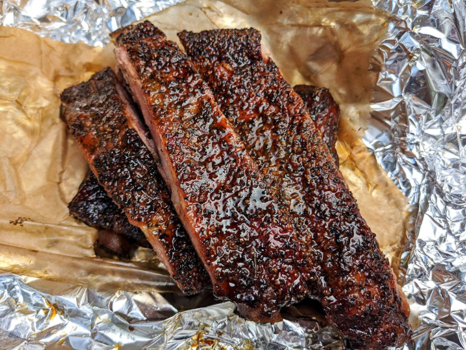 These ribs don't just fall off the bone&mdash;they practically leap into your mouth. The glistening bark tells stories of patient smoking and perfect timing.