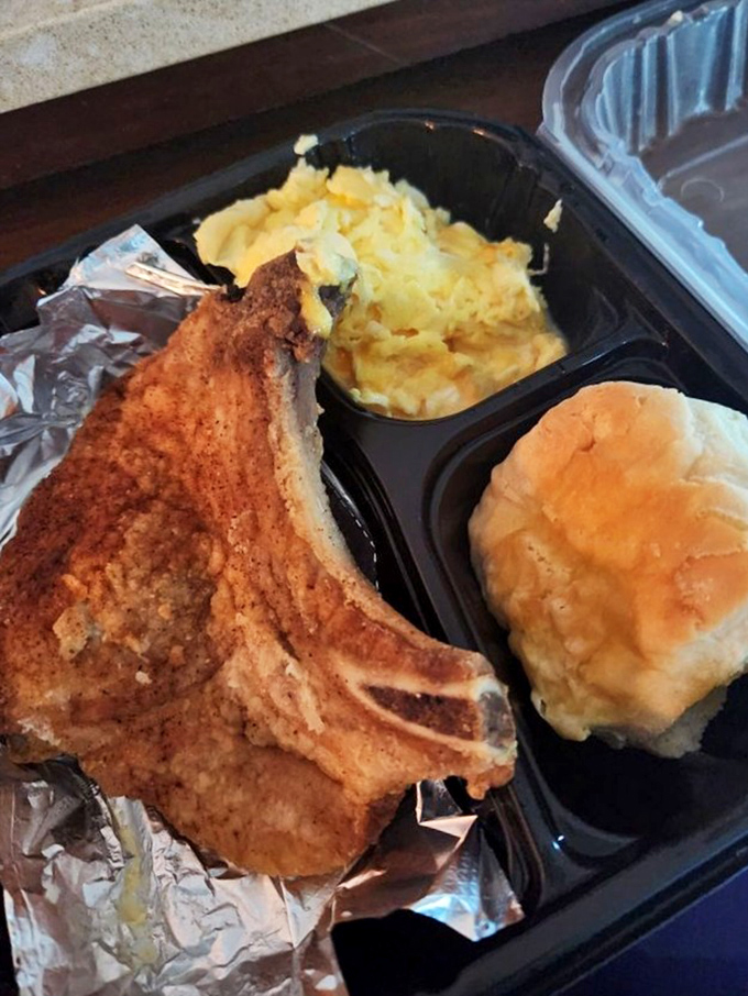 That porkchop has the kind of sear that makes professional chefs jealous. Paired with fluffy eggs and a biscuit that clearly wasn't born from a tube.