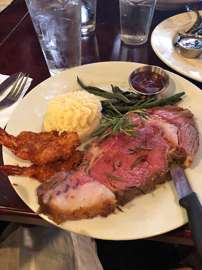 This isn't just prime rib—it's a masterclass in meat. The rosemary sprig isn't garnish, it's a magic wand.
