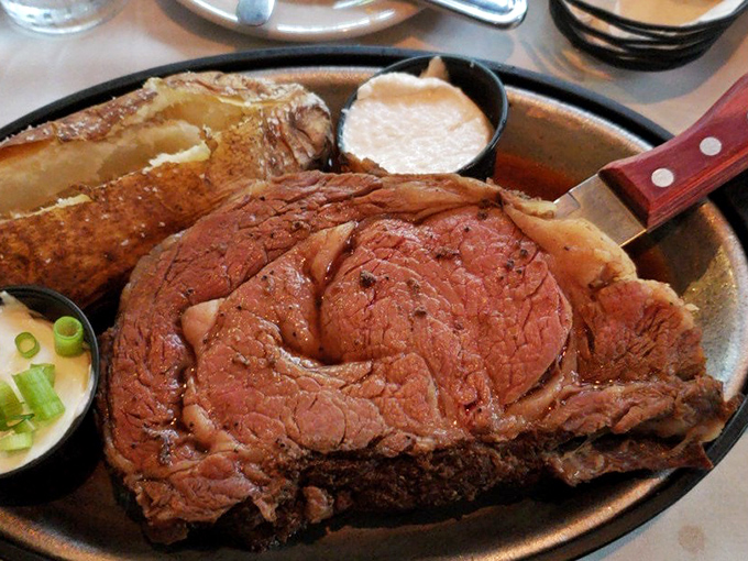 When your prime rib arrives with a baked potato standing guard beside it, you understand why some relationships are simply meant to be.