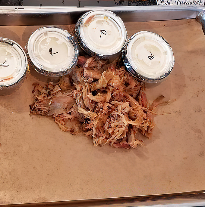 Pulled pork so tender it practically shredded itself. The containers of sauce are just formalities&mdash;this meat stands gloriously on its own.
