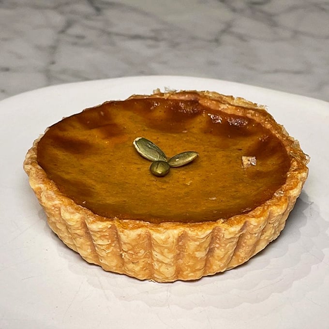 This pumpkin tart isn't just seasonal&mdash;it's a philosophy. Perfectly spiced filling in a crust that shatters just right with each bite. 