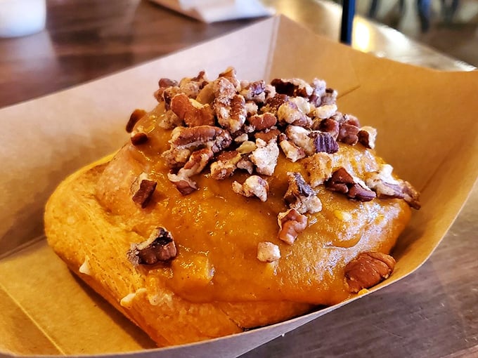 Not all heroes wear capes, but this pumpkin spice cinnamon roll&mdash;crowned with pecans and caramel&mdash;definitely deserves a medal for breakfast bravery.