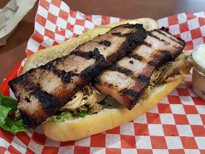 The brisket sandwich that launched a thousand road trips. Thick-cut, smoke-ringed perfection nestled between bread that knows its supporting role.