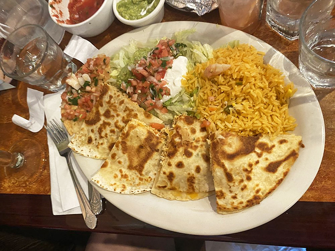 Quesadillas done right&mdash;properly browned tortillas, cheese that actually stretches, and rice that respects itself enough not to clump together.