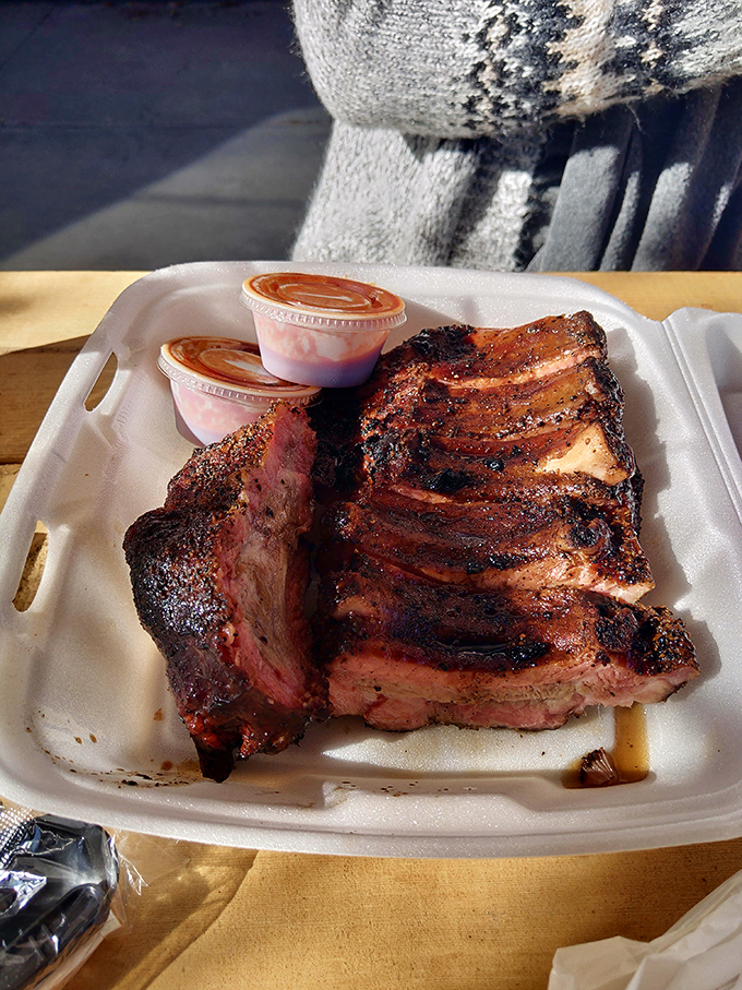 These ribs don't need a sales pitch. The bark, the smoke ring, and that glistening surface tell you everything you need to know about Sparky's smoking expertise. 