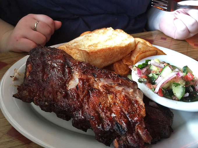 The perfect barbecue trinity: smoky ribs, creamy mac and cheese, and a cucumber salad that cuts through the richness like a refreshing breeze.