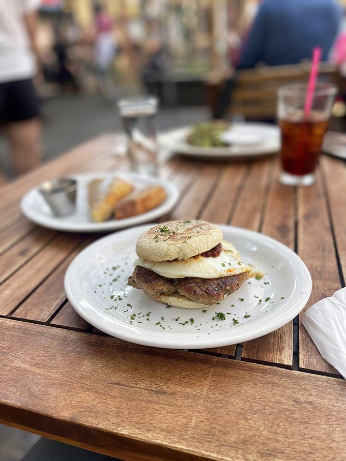 Breakfast sandwich perfection exists, and here's the evidence. That sausage patty and egg combo on an English muffin is the morning hero we deserve.