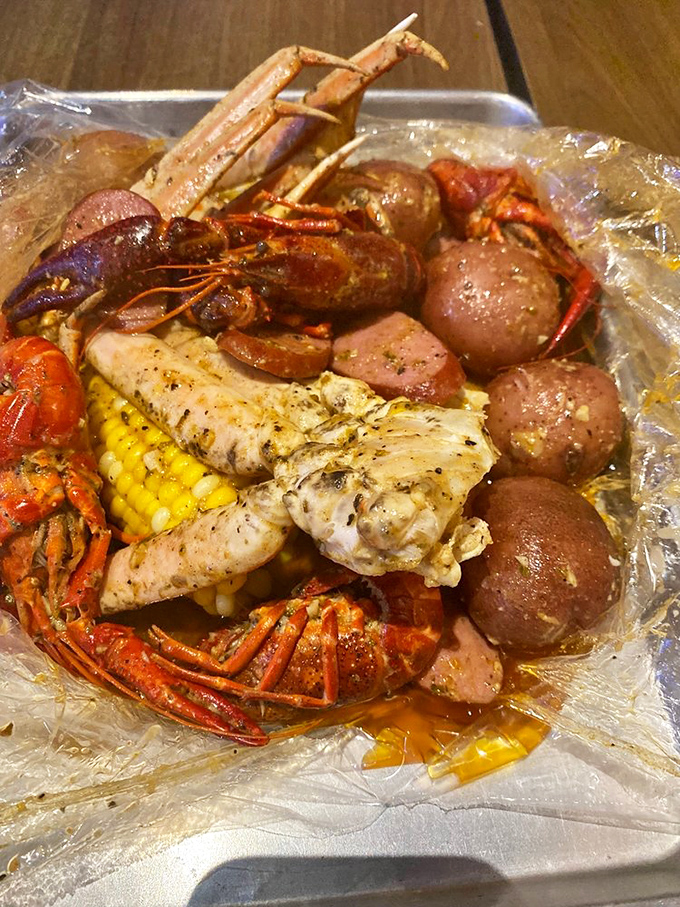 This clear bag reveals treasures more valuable than any pirate's chest &ndash; crawfish, potatoes, corn, and sausage bathing in seasoned glory.