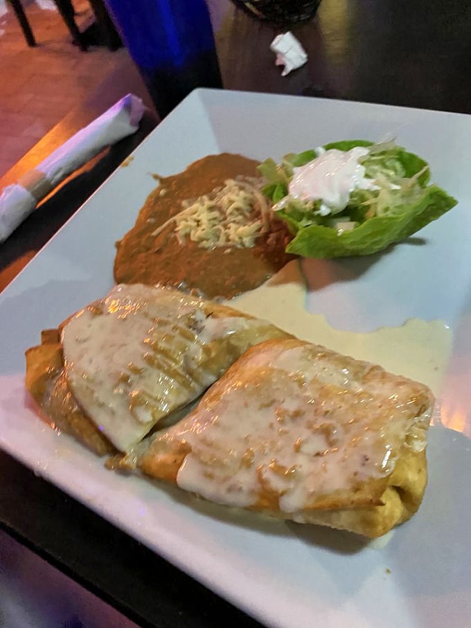 These aren't just chimichangas&mdash;they're architectural masterpieces of crispy exterior and savory interior, glazed with cheese like the Sistine Chapel of Tex-Mex.