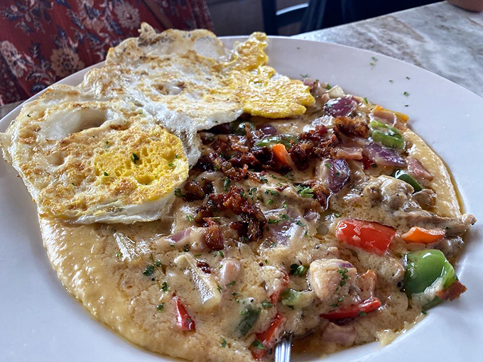 The brunch trifecta: farm-fresh eggs, creamy grits, and succulent shrimp. This plate has more layers of flavor than your favorite binge-worthy drama series.