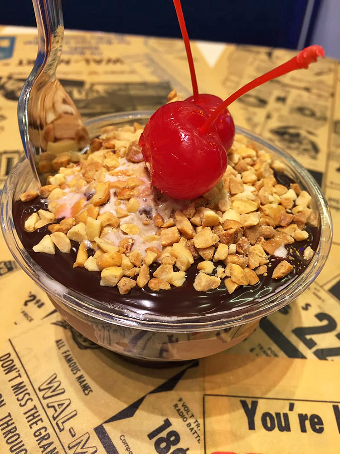 The peanut-topped sundae sports a cherry so red it's practically winking at you, daring you not to smile back.