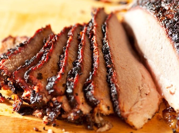 Each slice of brisket tells a story of patience and smoke. That pink smoke ring isn't just pretty&mdash;it's a barbecue badge of honor.