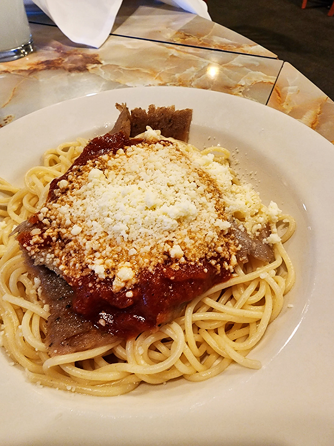 Greek spaghetti: where Mediterranean meets comfort food in a romance that would make Zeus himself swoon. That feta sprinkle is pure genius.