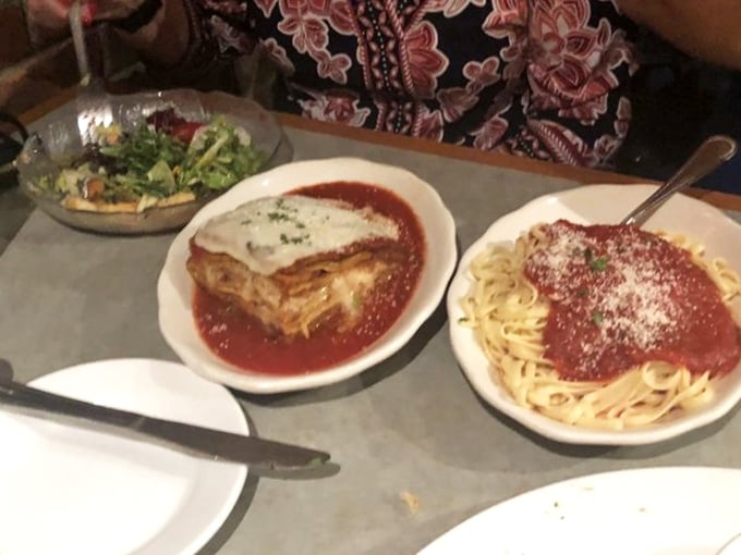 The holy trinity of Italian comfort: garden salad, lasagna, and spaghetti with marinara &ndash; a meal that feels like a warm hug.