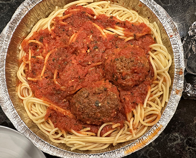 Meatballs that don't need to be the size of softballs to make their point - tender, herbaceous, and nestled in sauce that clings lovingly to every strand.