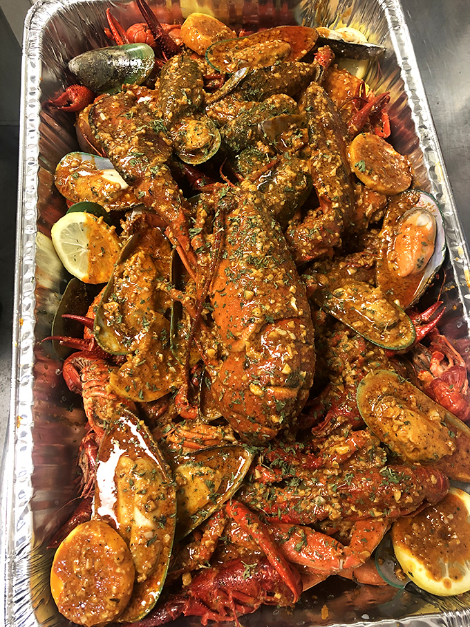 This seafood medley isn't just a meal, it's a maritime festival in an aluminum pan, where every shellfish gets its moment in the spotlight.