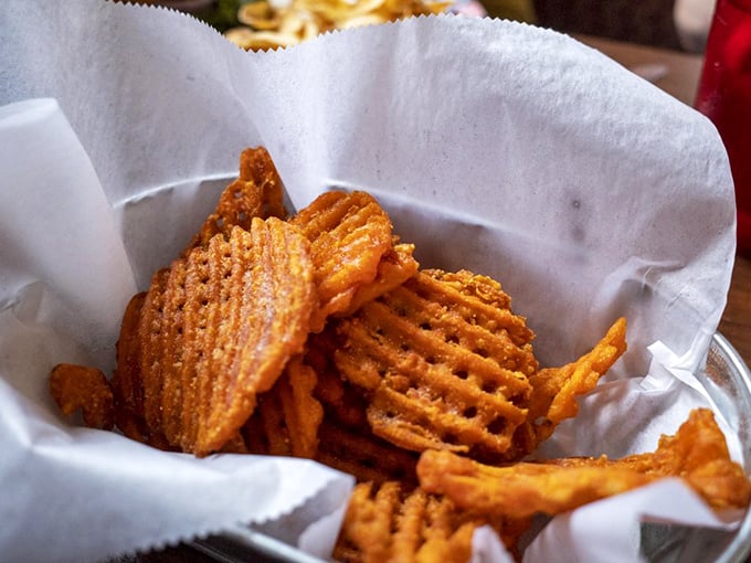 Sweet potato waffle fries that crunch like autumn leaves. These golden-orange beauties make regular fries seem like they're not even trying.